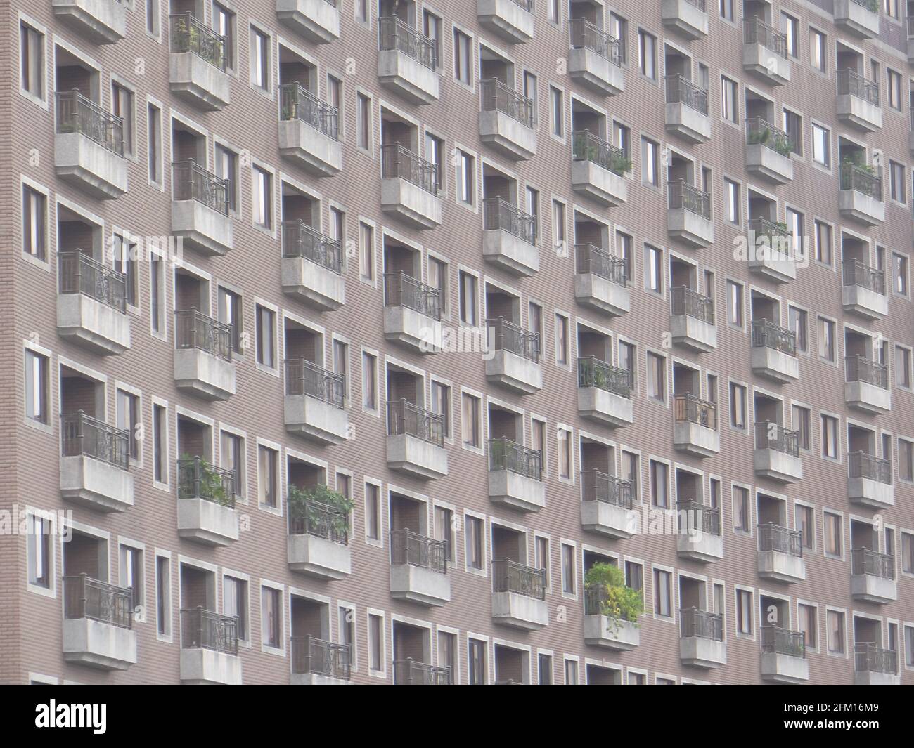 Reinforced concrete building with hundreds of windows and balconies ...