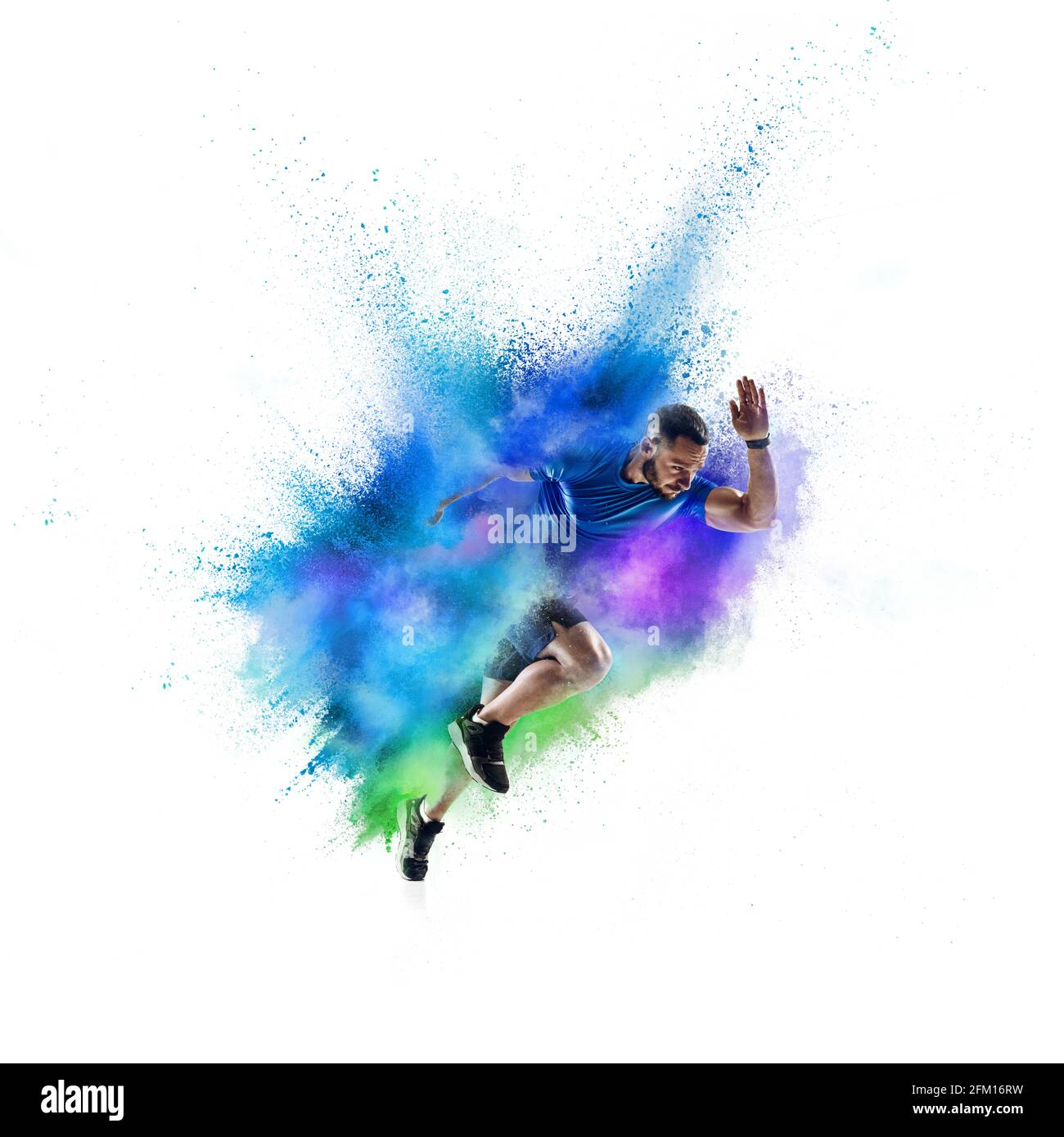 One Caucasian sportsman in explosion of colored neon powder isolated on ...