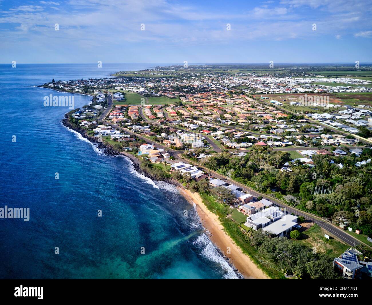 Aerial of the waterfont houses along Kellys Beach Bargara Queensland ...