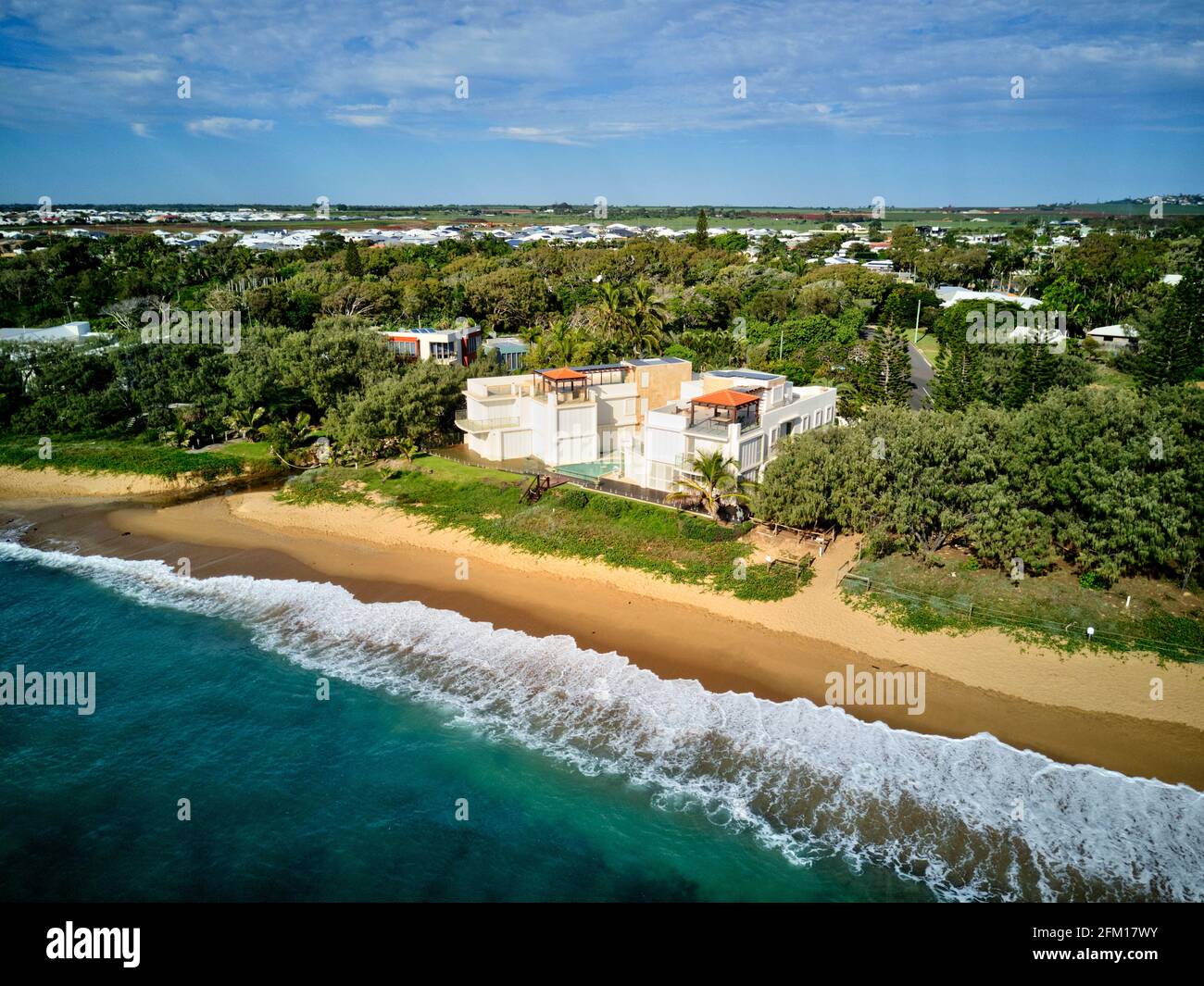 Aerial of the waterfront houses including the "Glass House" at Kellys ...