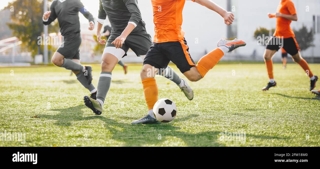 Group of Football Players Running and Kicking League Match. Adult ...