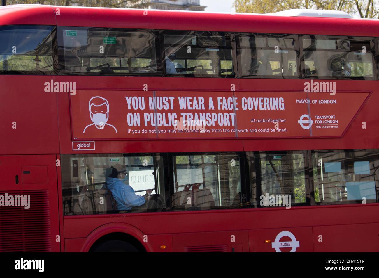 You must wear a face covering on public transport sign on red London ...