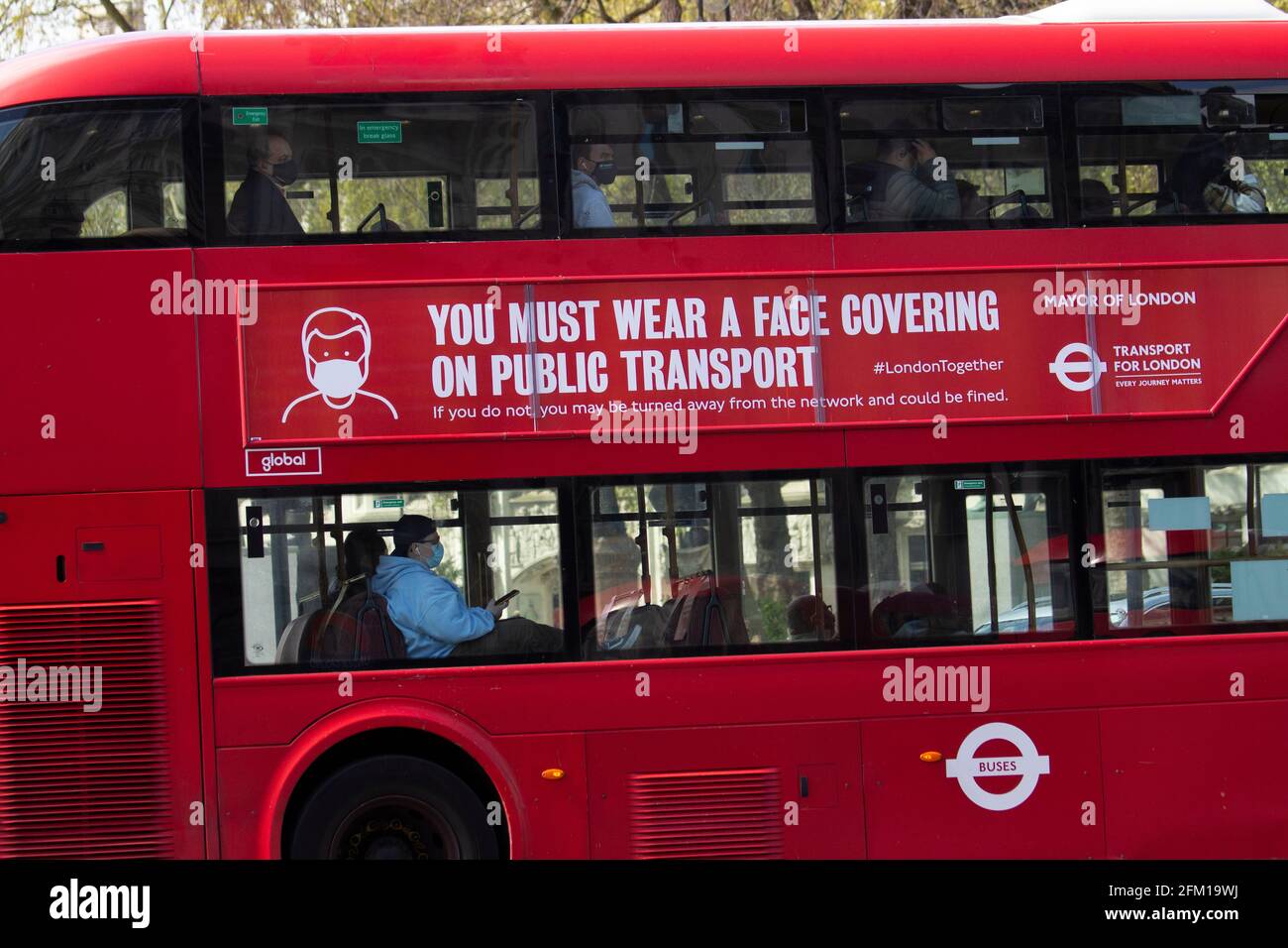 You must wear a face covering on public transport sign on red London ...