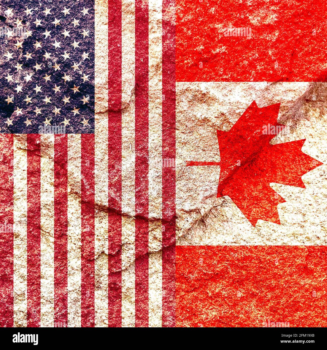 USA flag and Canada flag on a rock wall background Stock Photo - Alamy