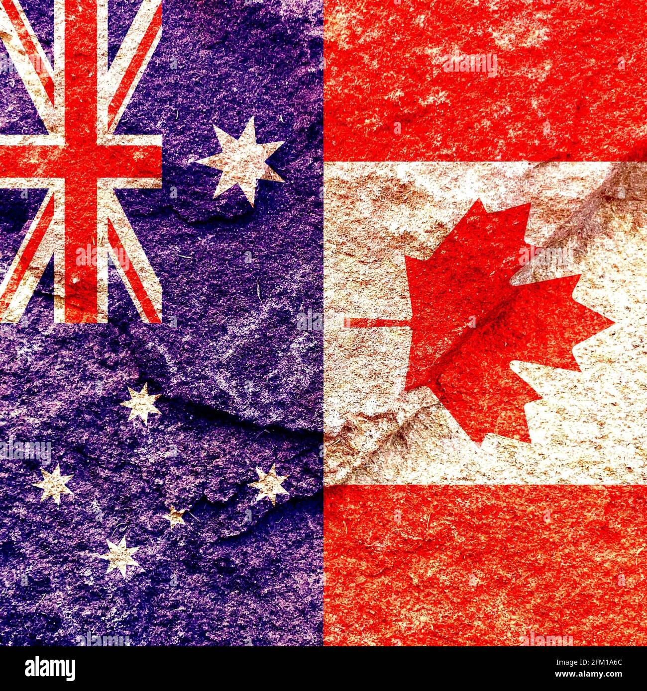 Australia flag and Canada flag on a rock wall background Stock Photo ...