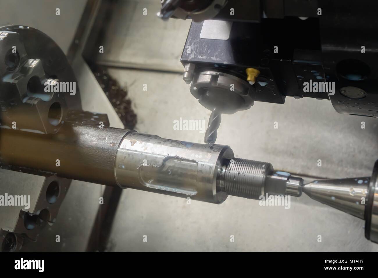 Turning milling machine cutting metal workpiece at metalworking ...