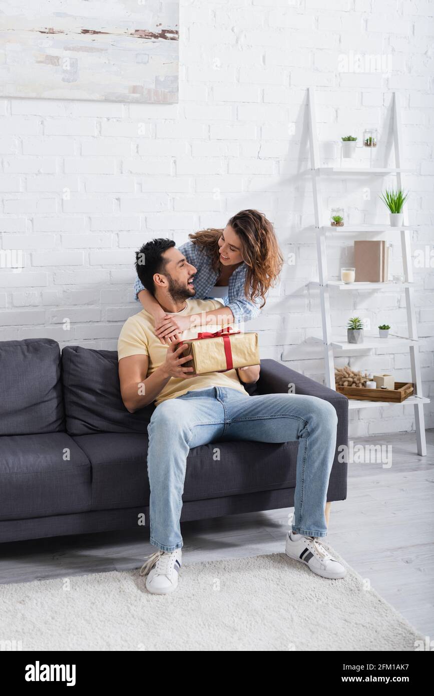 Muslim man holding gift box hi-res stock photography and images - Alamy