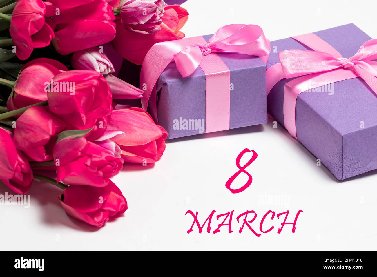 Tulips and lilac gift boxes with an inscription 8 March. International ...
