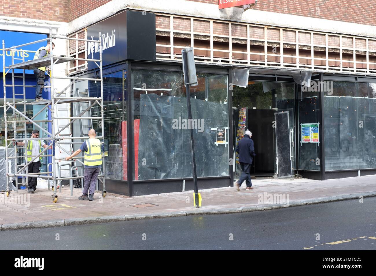 Shop front being refitted with new signage for a new high street ...