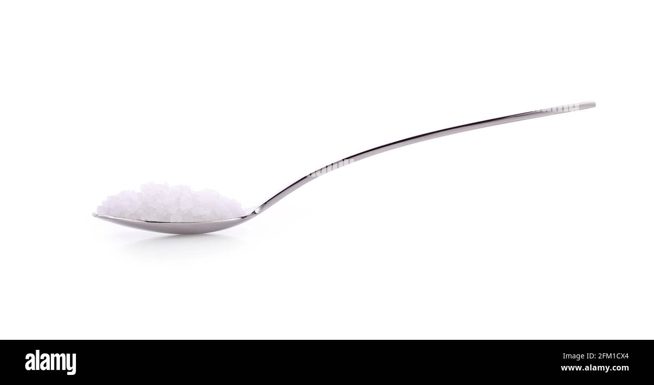 Salt spoon on white background Stock Photo - Alamy