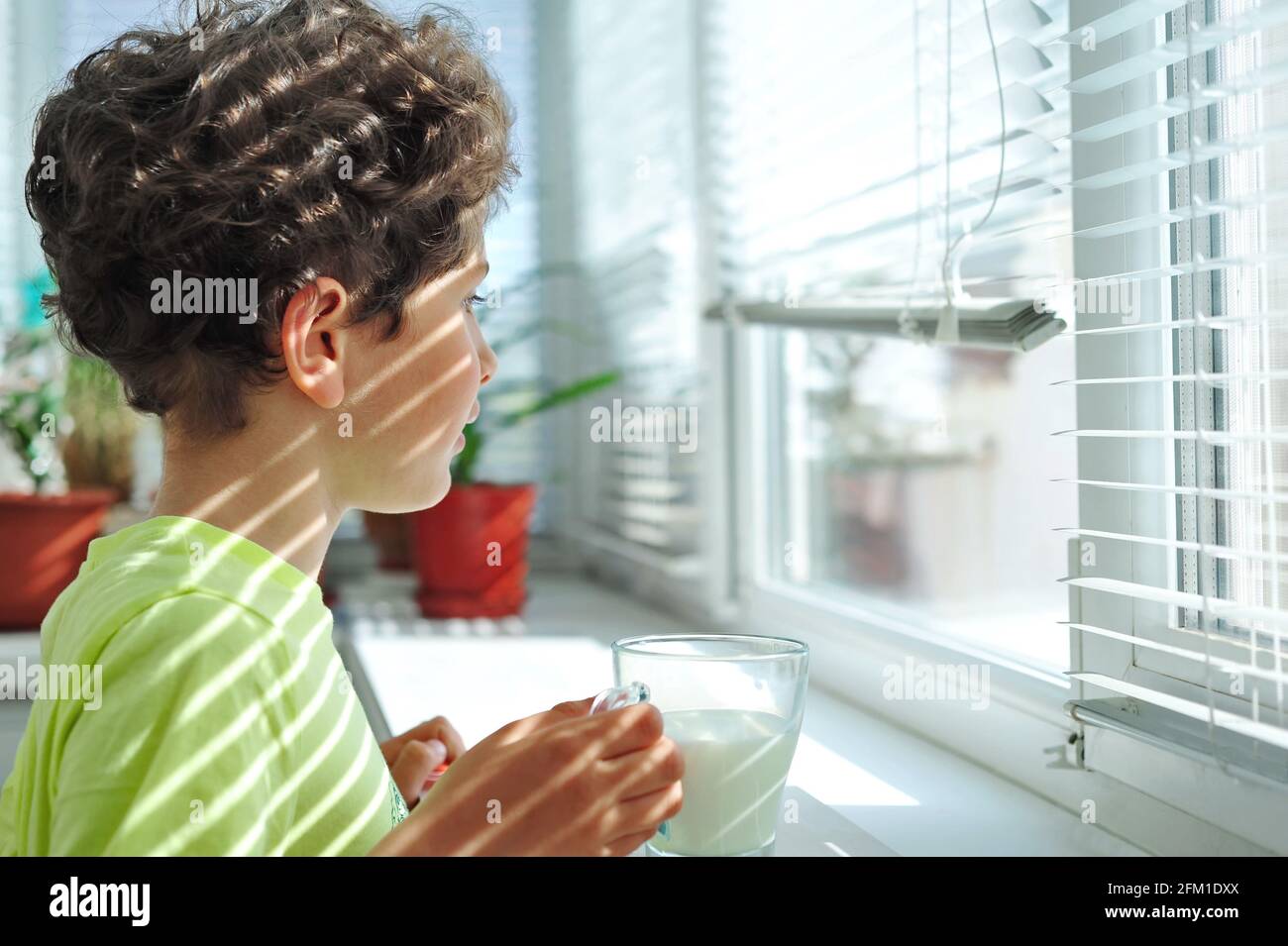 Cute little boy drinks healthy milk. Happy Milk Day! Stock Photo - Alamy