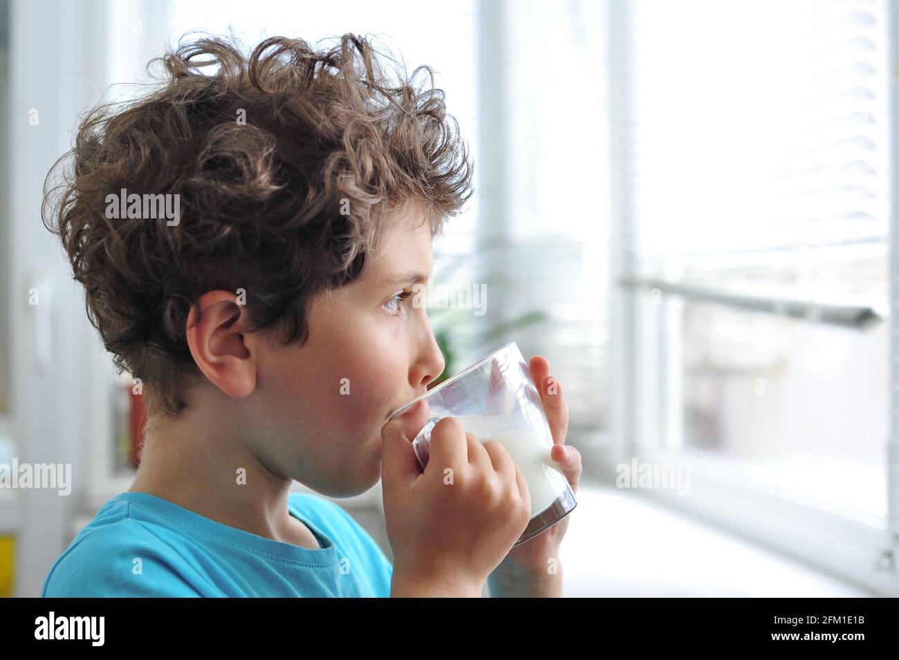 Cute little boy drinks healthy milk. Happy Milk Day! Stock Photo - Alamy