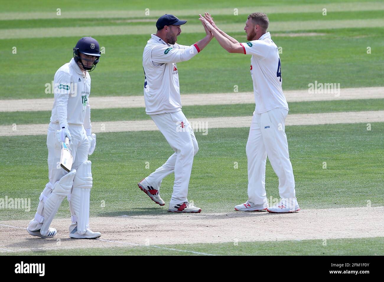 Jamie Porter of Essex celebrates taking the wicket of Tom Alsop during ...