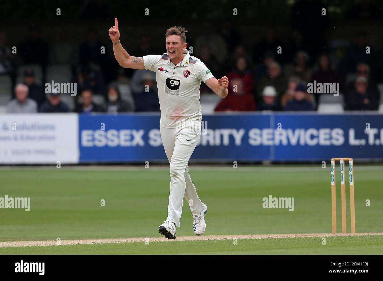Harry Podmore of Kent celebrates taking the wicket of Daniel Lawrence ...