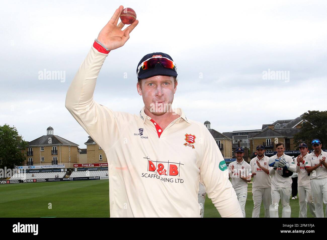 Simon Harmer of Essex raises the ball to the crowd after taking eleven ...