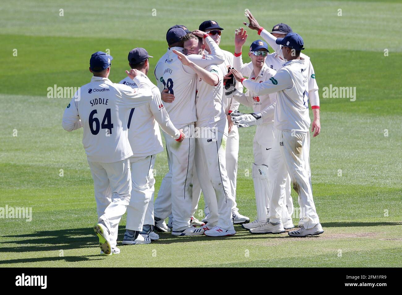 Sam Cook of Essex celebrates with his team mates after taking the ...