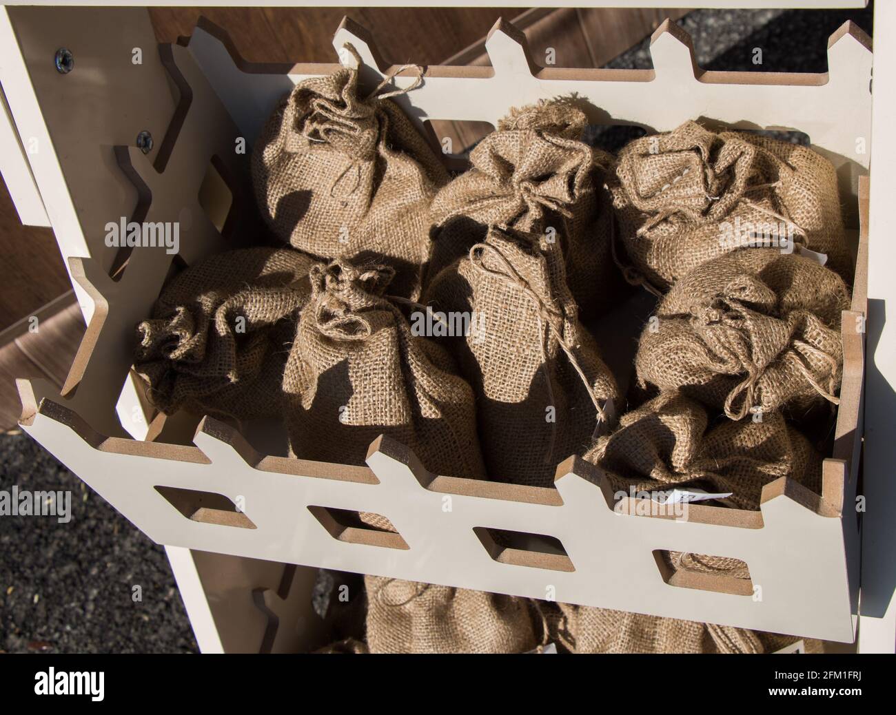 Wooden box full of sack bags Stock Photo - Alamy