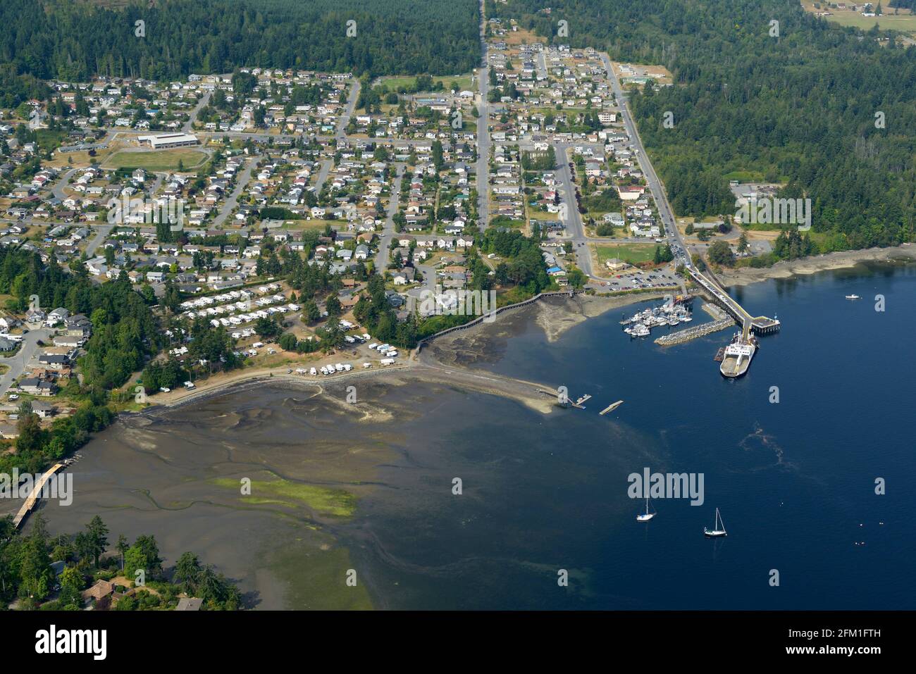 Aerial photograph of Crofton and the BC Ferry, Howe Sound Queen at the ...