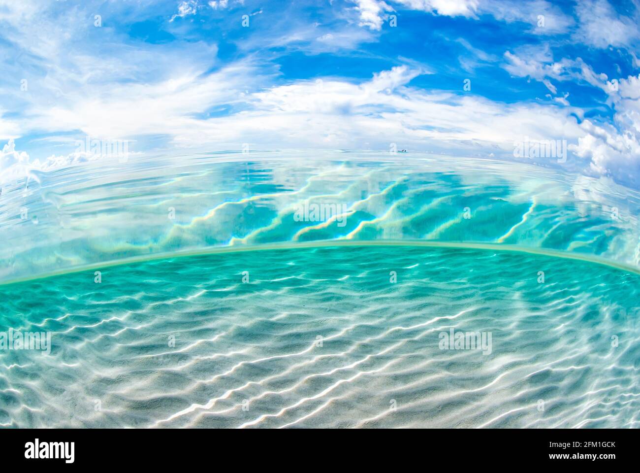 Half above and half below image of white Caribbean sand Stock Photo - Alamy