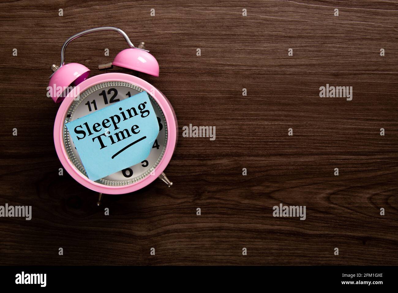 Alarm clock with Sleeping time word on sticky note. Healthy Concept ...