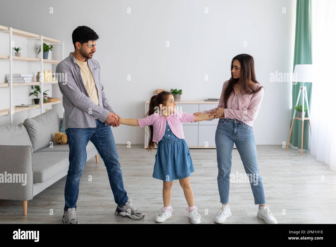 Divorce concept. Arab parents fighting over their child, mad man and ...