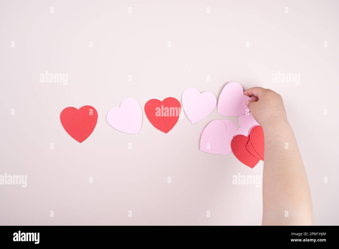 A child holding a heart in his hand Stock Photo - Alamy