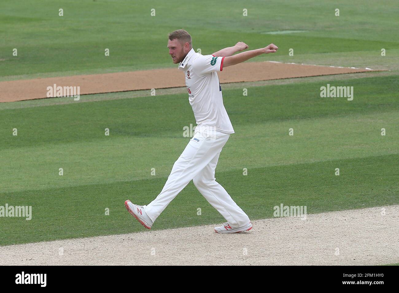 Jamie Porter of Essex celebrates taking the wicket of Adam Lyth during ...