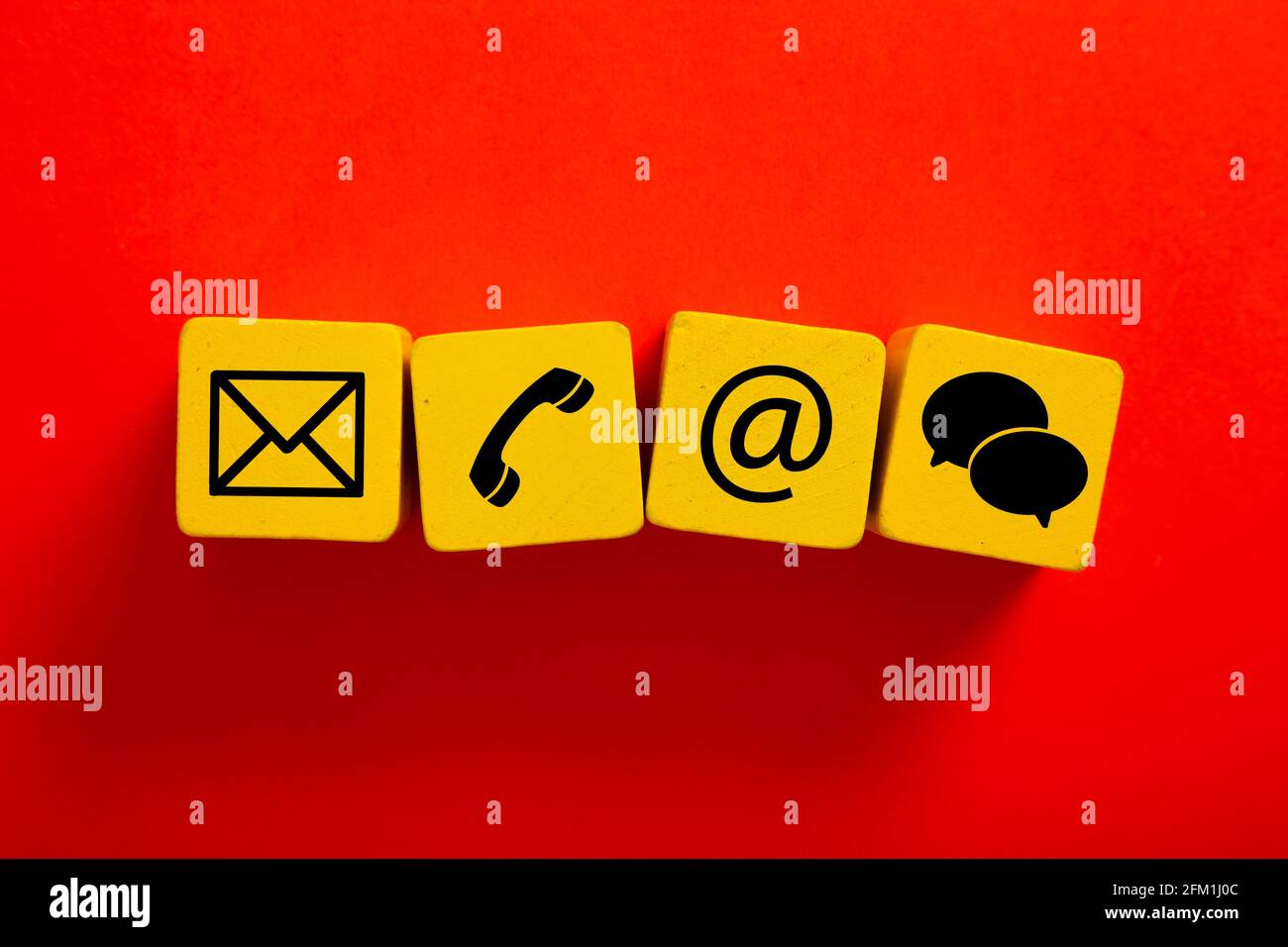 Wooden block with symbol telephone, email, address and comunication ...