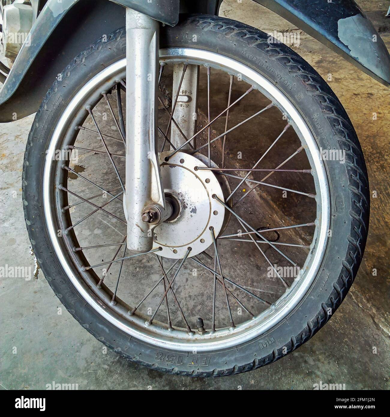 dirty motorcycle wheels photo Stock Photo - Alamy