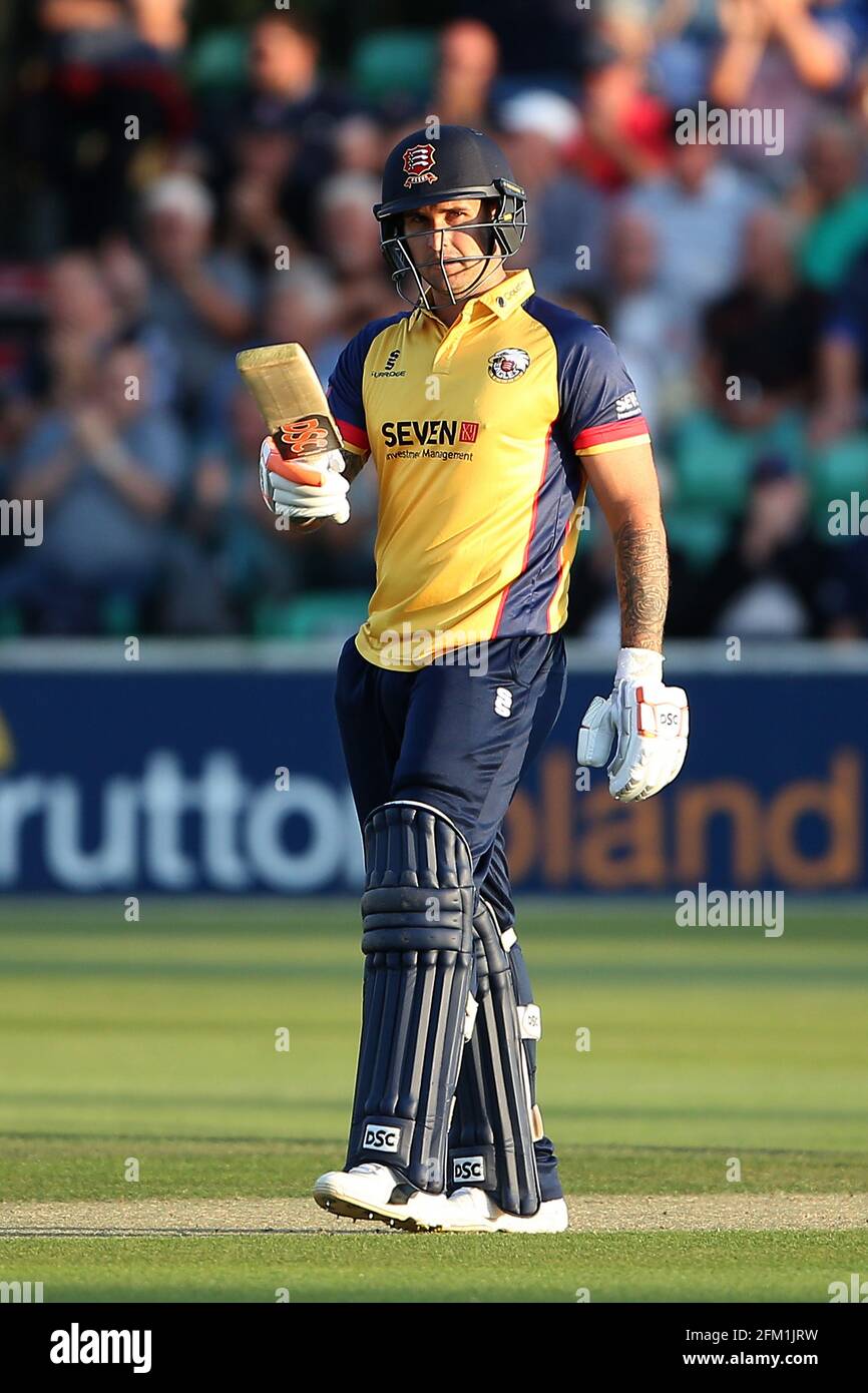 Cameron Delport of Essex raises his bat to celebrate reaching his fifty ...