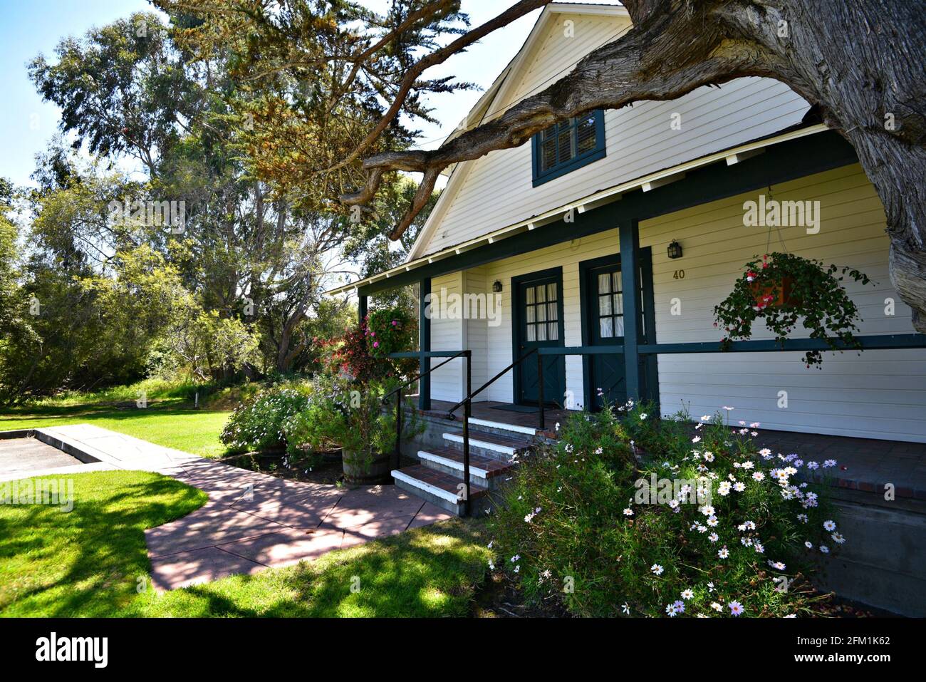 Landscape with a Normandy Revival style cottage in the countryside of ...