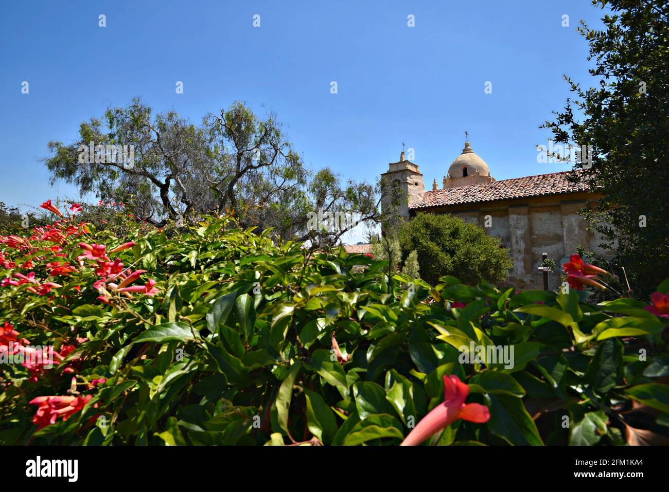Landscape with scenic view of Mission San Carlos Borromeo de Carmelo, a ...