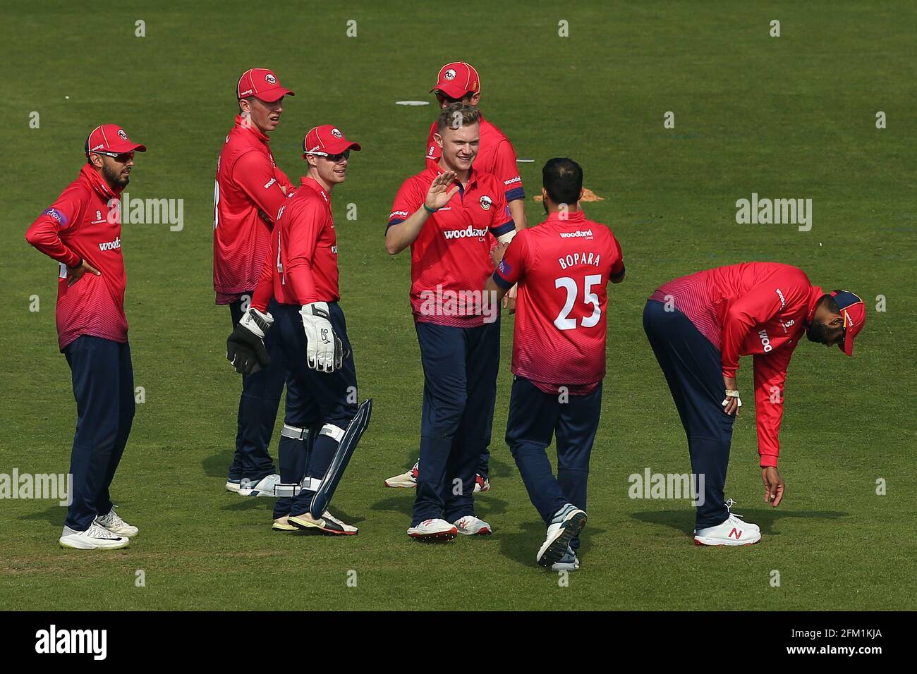 Sam Cook of Essex celebrates with his team mates after taking the ...
