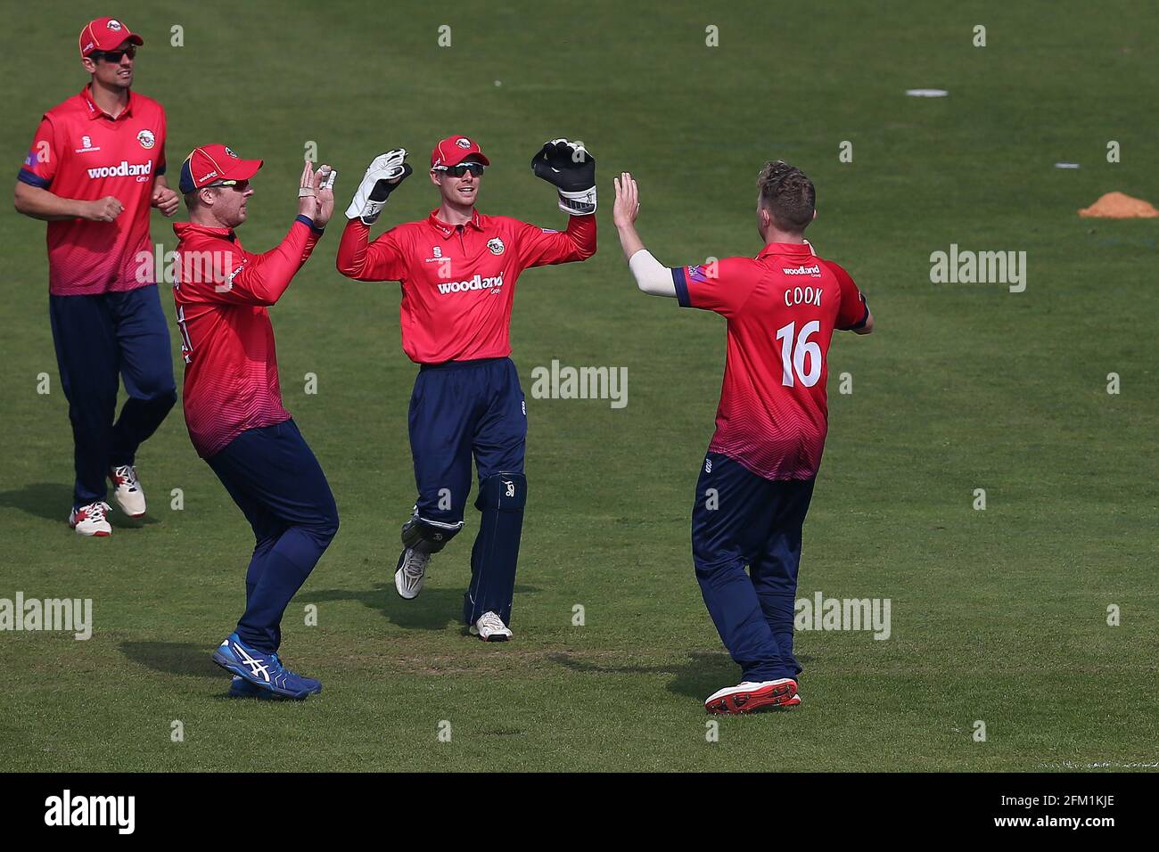 Sam Cook of Essex celebrates with his team mates after taking the ...