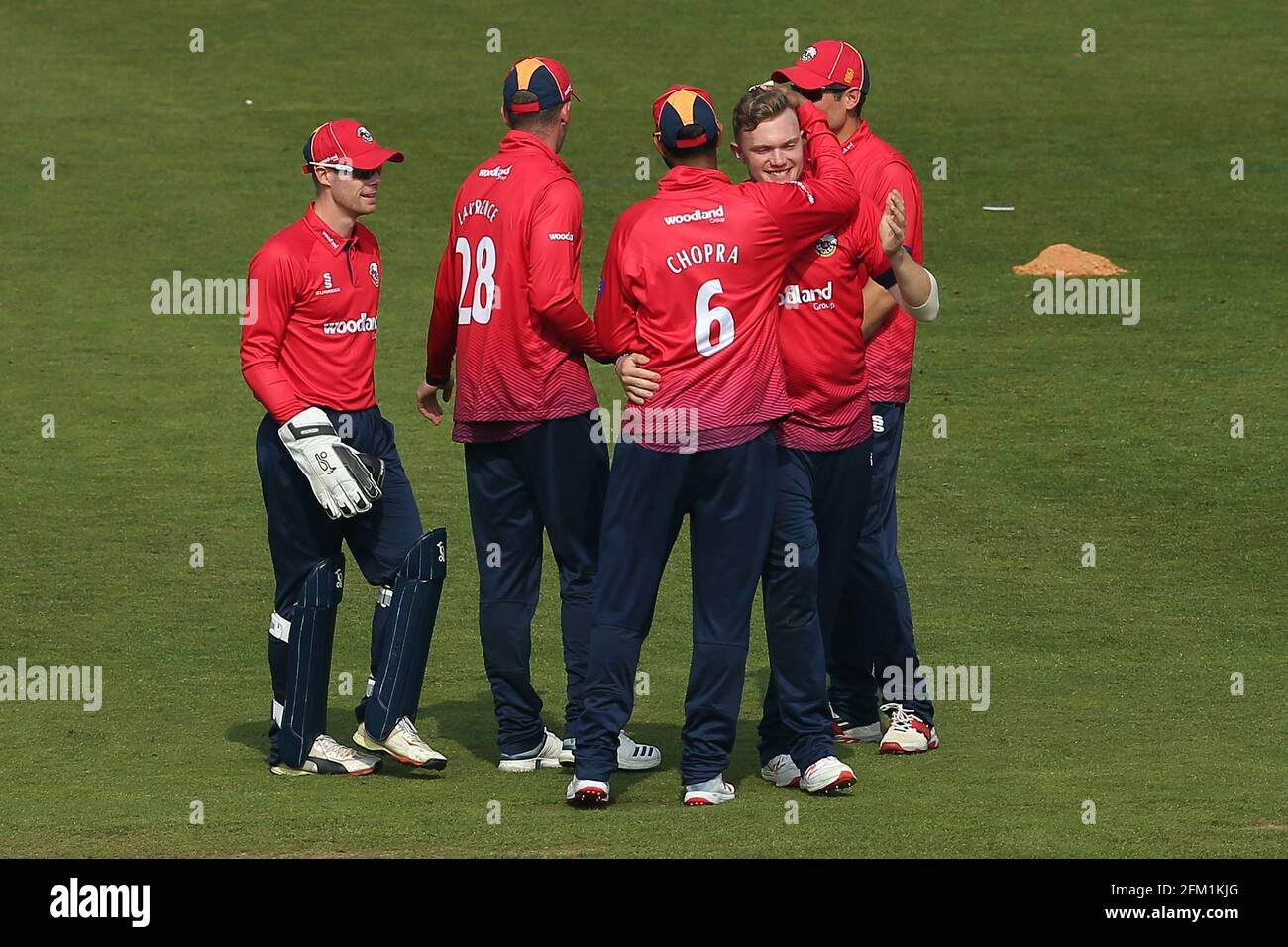 Sam Cook of Essex celebrates with his team mates after taking the ...