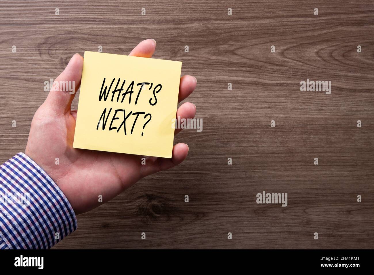 Hand holding notepad with text What's Next? Conceptual Image Stock ...