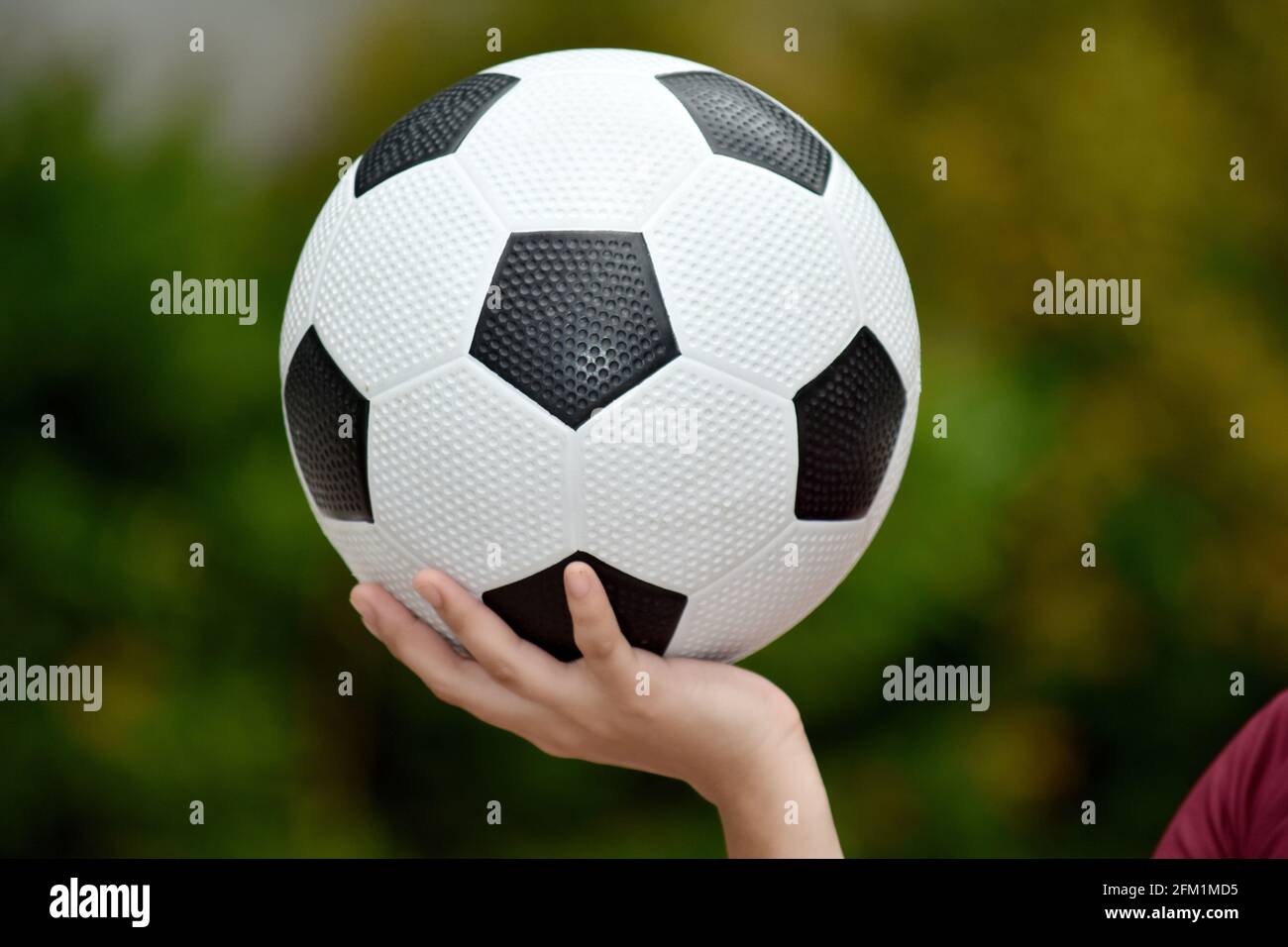 A Hand Holding Soccer Ball Stock Photo - Alamy