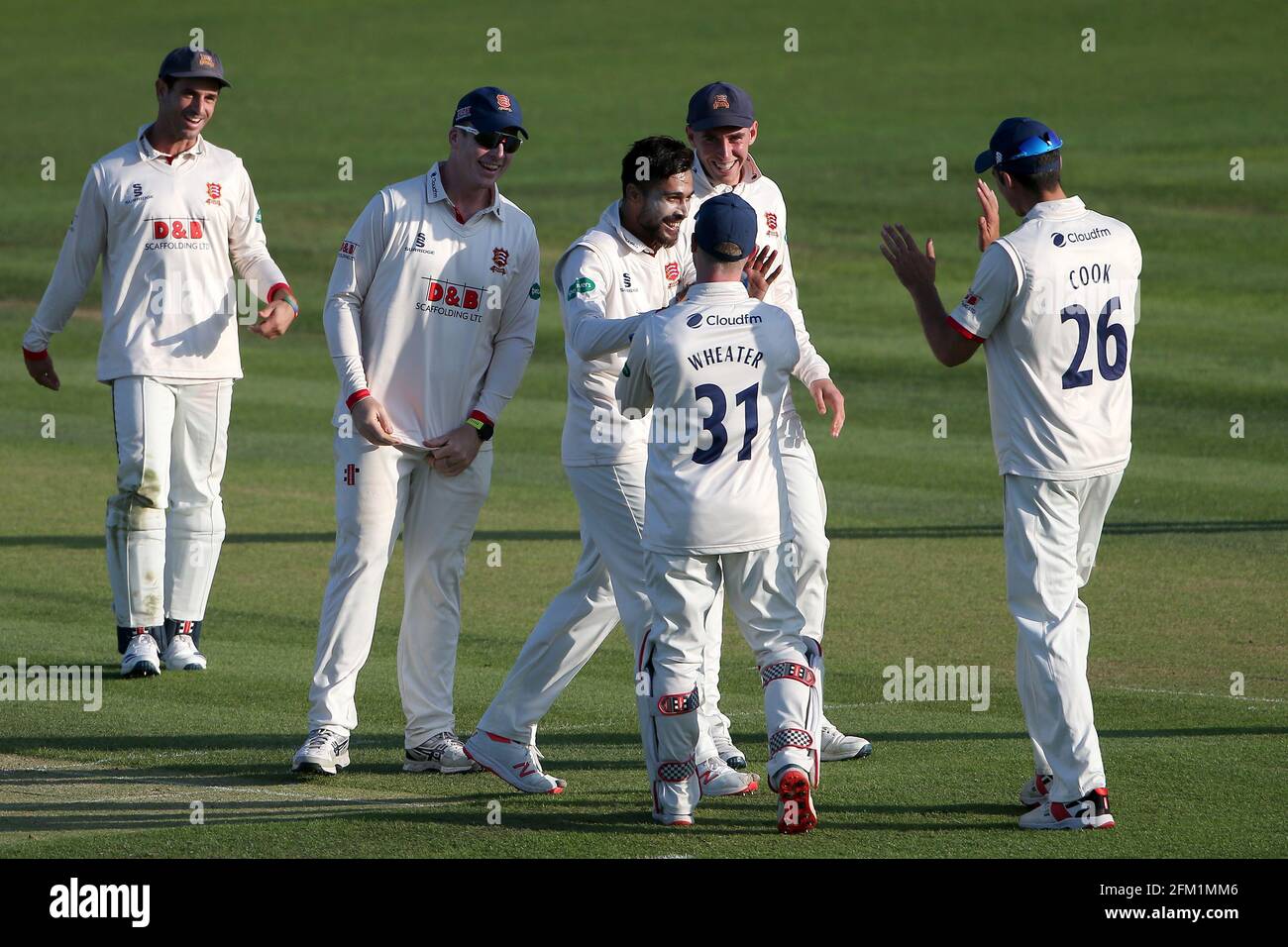 Mohammad Amir of Essex celebrates with his team mates after taking the ...