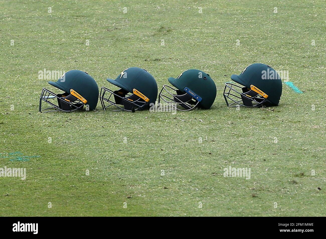 Cricket helmets on outfield hi-res stock photography and images - Alamy