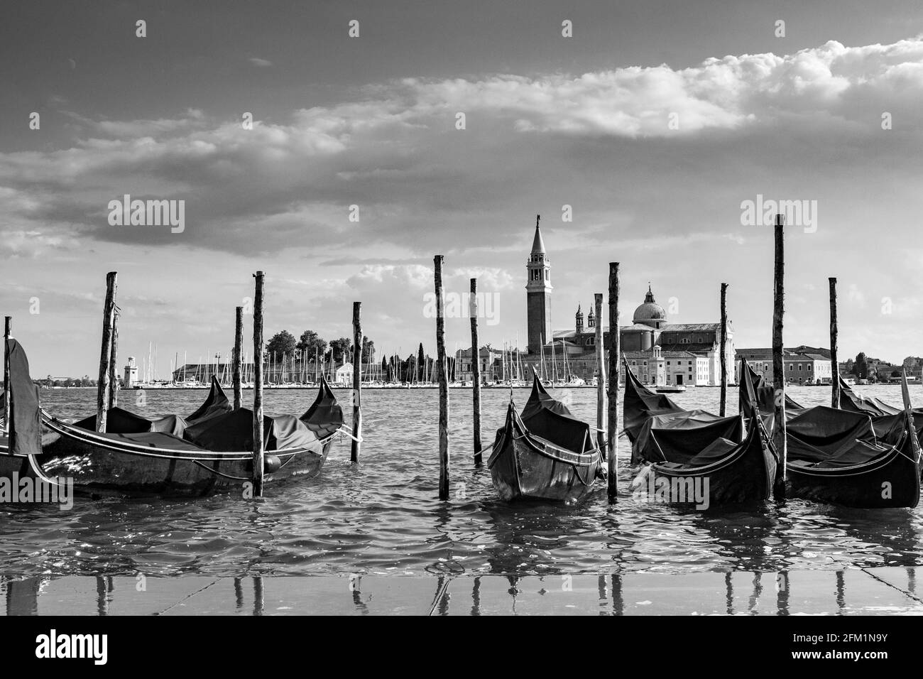 Grayscale shot of Venice port with gondolas in Italy Stock Photo - Alamy