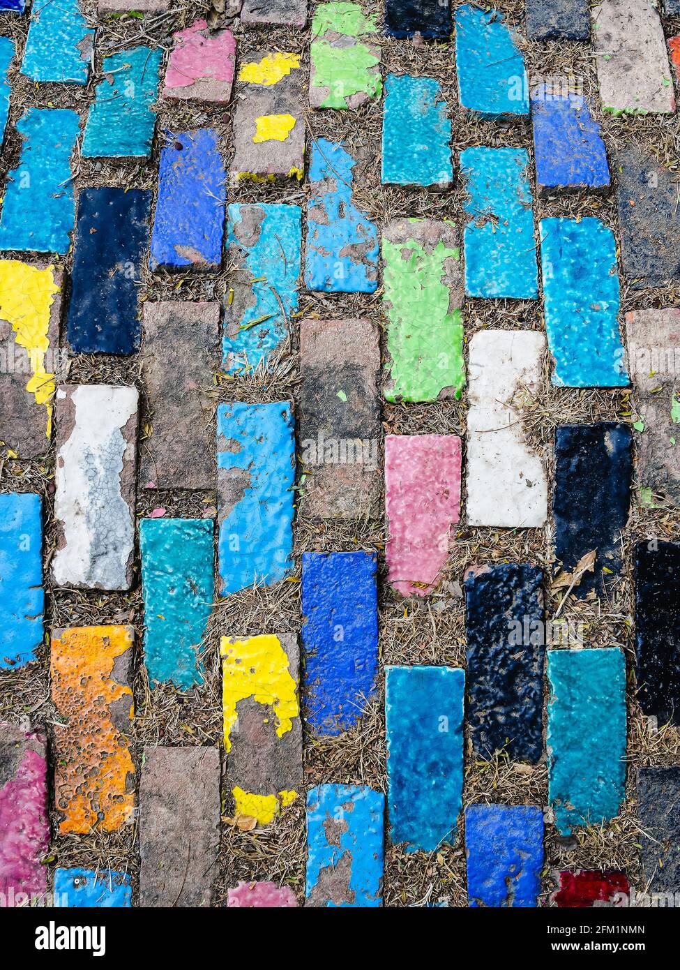 Top view on pieces of multicolored ceramic tiles decorated in garden ...