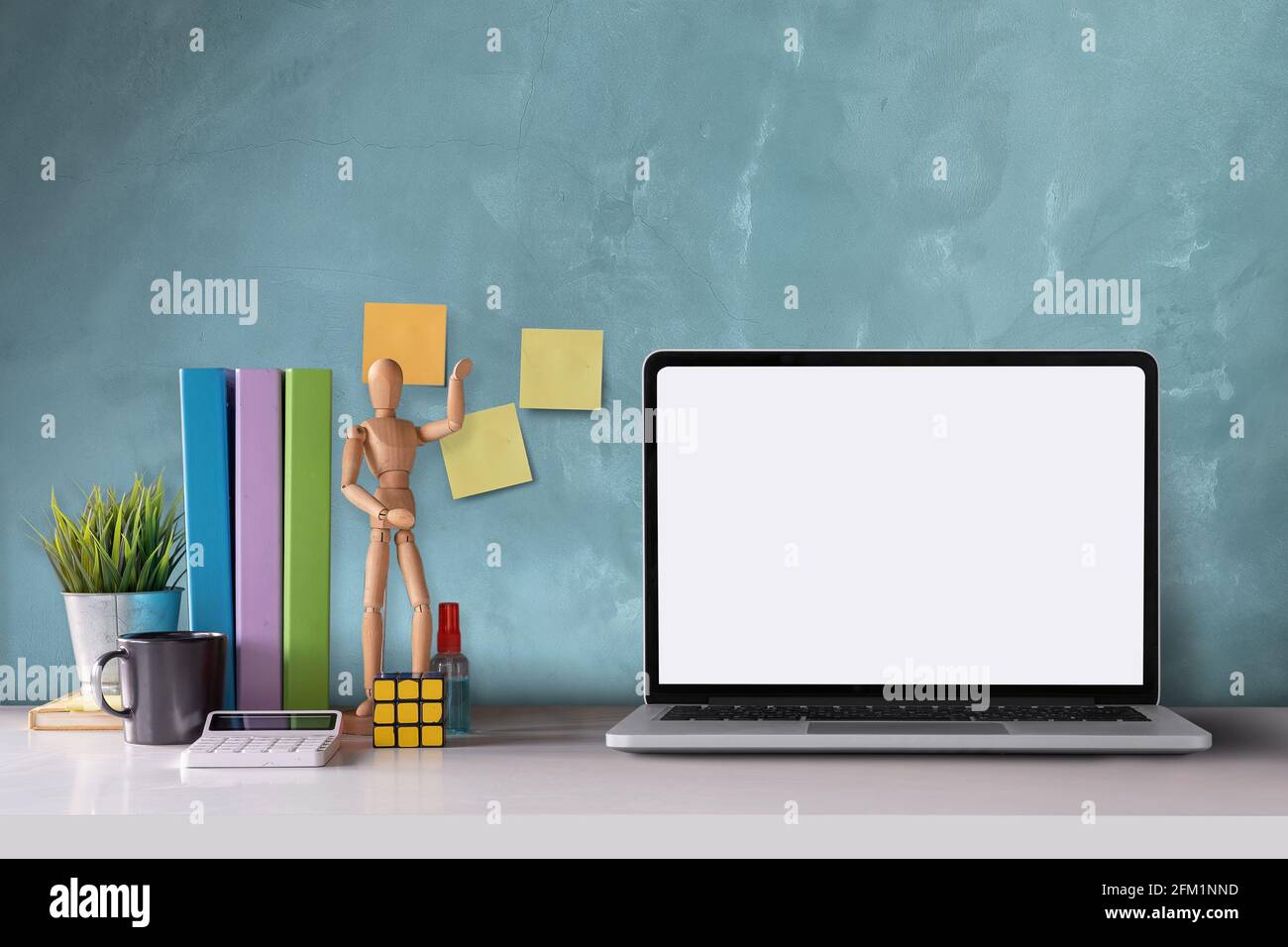 Mock up laptop computer with blank white screen of placed on office ...