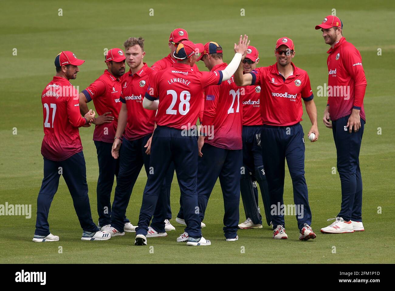 Sam Cook of Essex celebrates with his team mates after taking the ...
