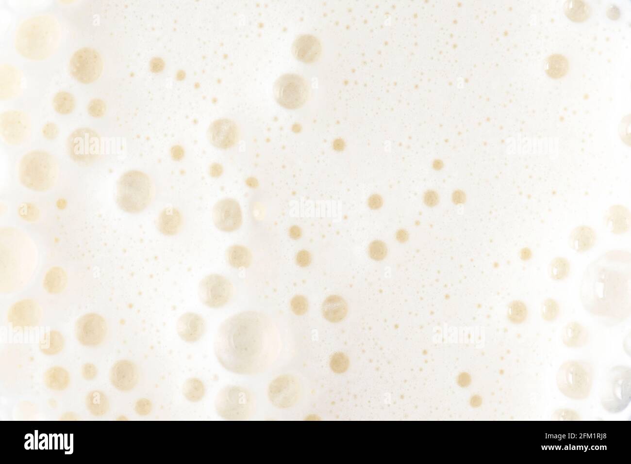 Foam of milkshake, cocktail with bubbles as texture or background, top ...
