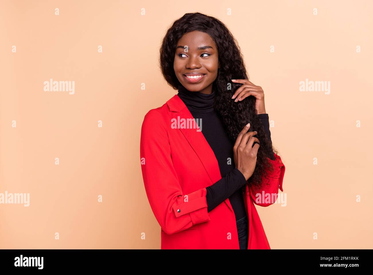 Photo of dreamy happy afro american lady look empty space touch hair ...