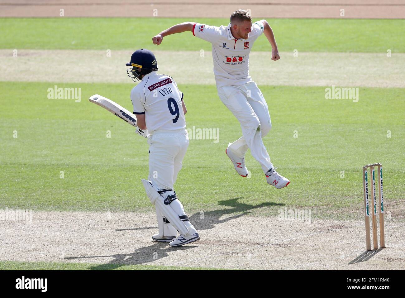Jamie Porter of Essex celebrates taking the wicket of Adam Lyth during ...