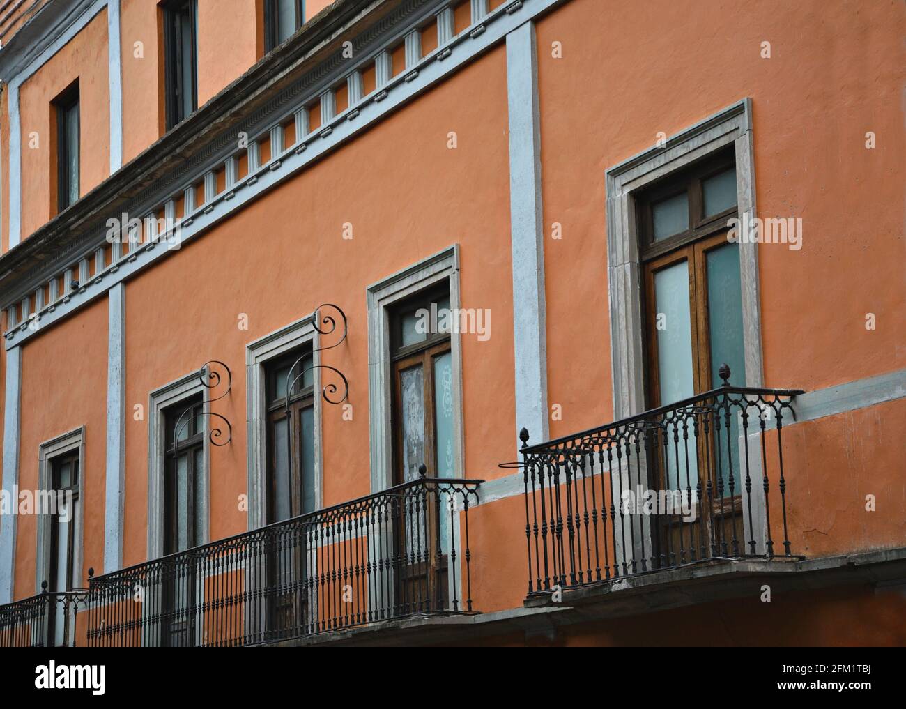 Spanish Colonial building facade with a Venetian stucco wall, wooden ...