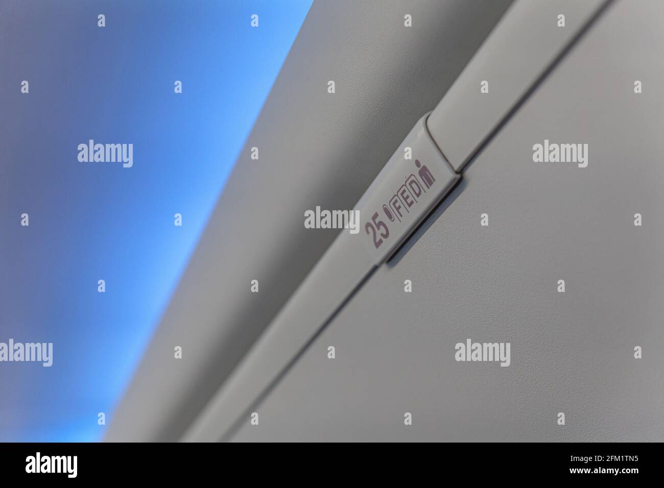 Sign of seat number with number and letter on luggage shell inside ...