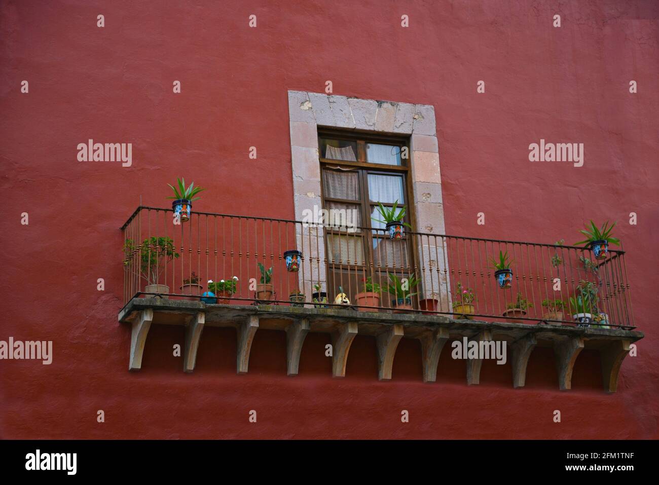 Spanish Colonial building facade with a Venetian red stucco wall, a ...