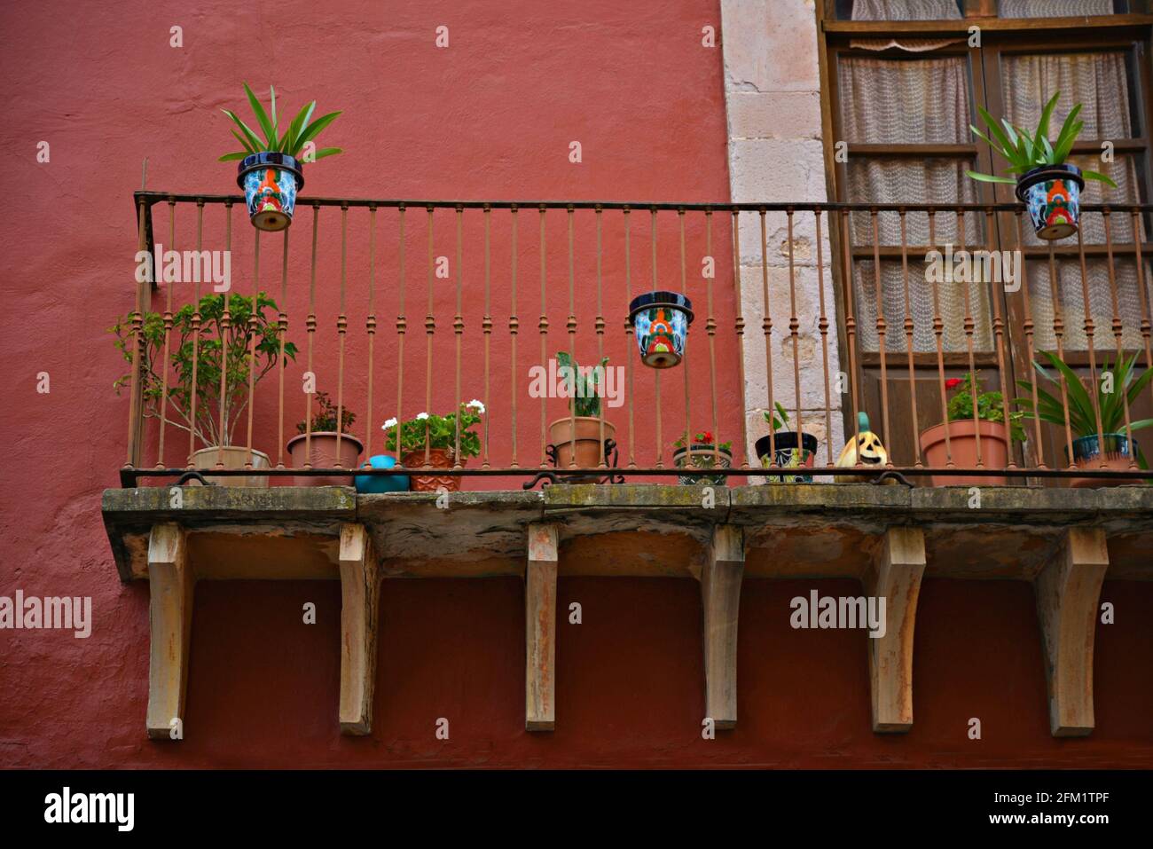 Spanish Colonial building facade with a Venetian red stucco wall, a ...